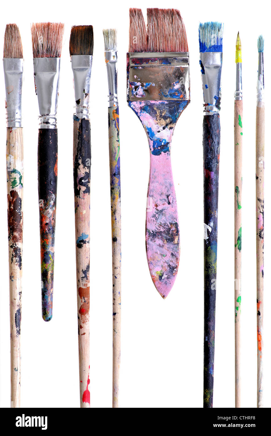 Various dirty paint brushes isolated on white Stock Photo - Alamy