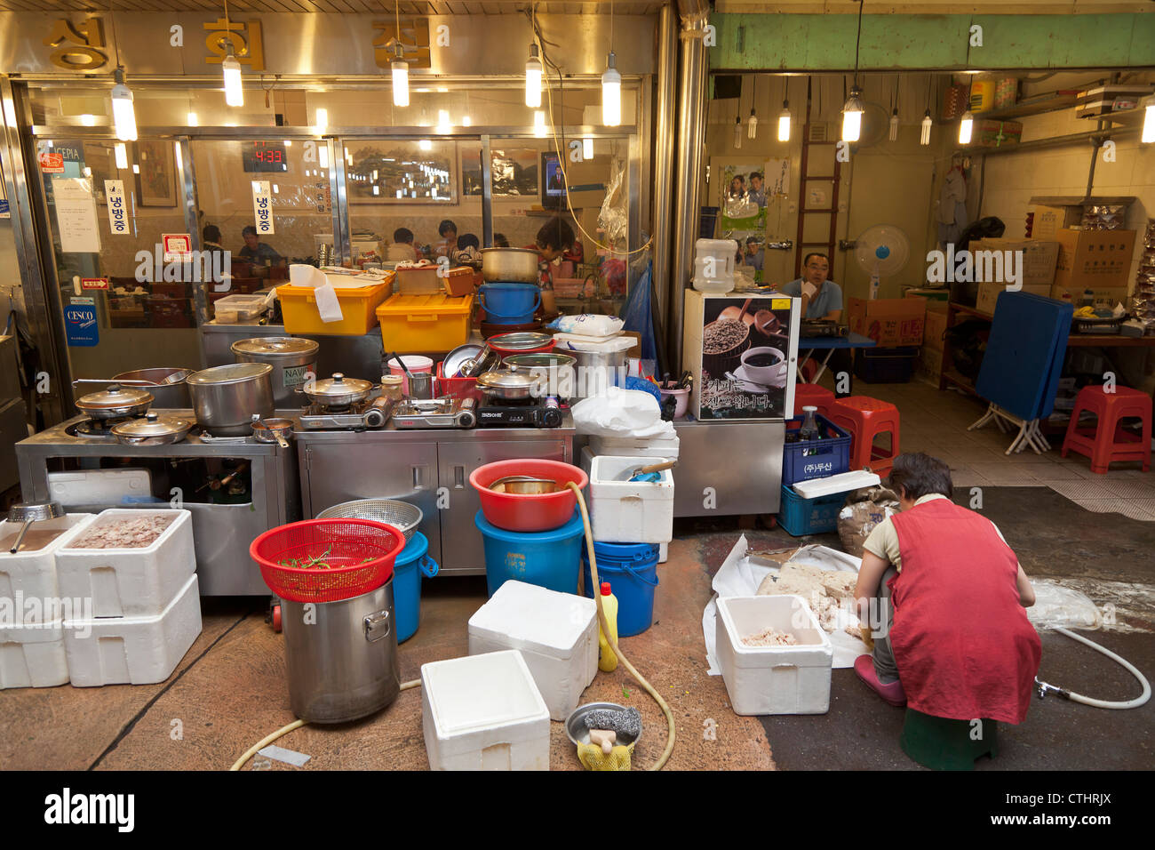 A worker cleans up after the lunch hour rush at Kwang Jang Market Stock ...