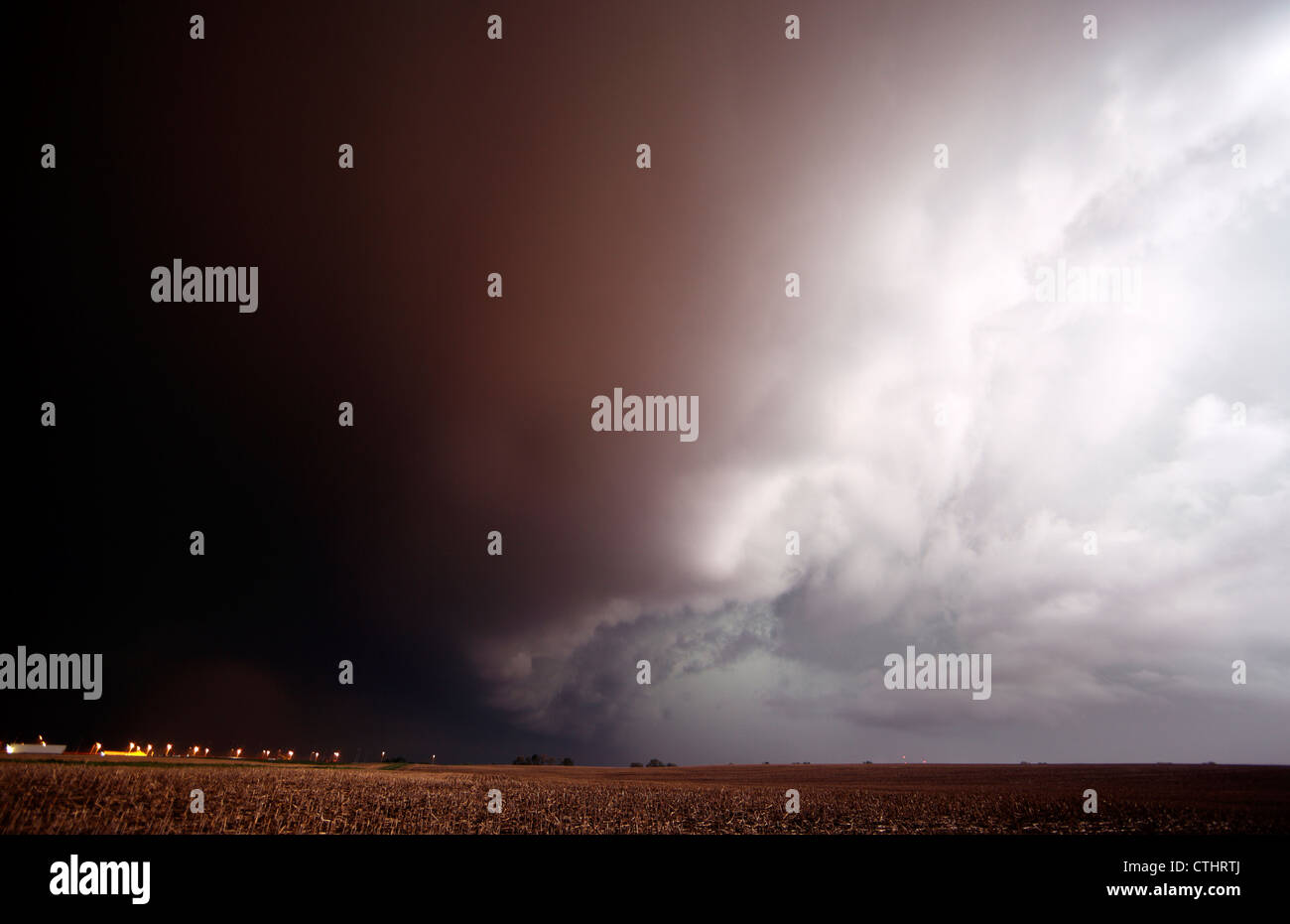Lightning shows the vivid detail of the back side of a passing squall ...