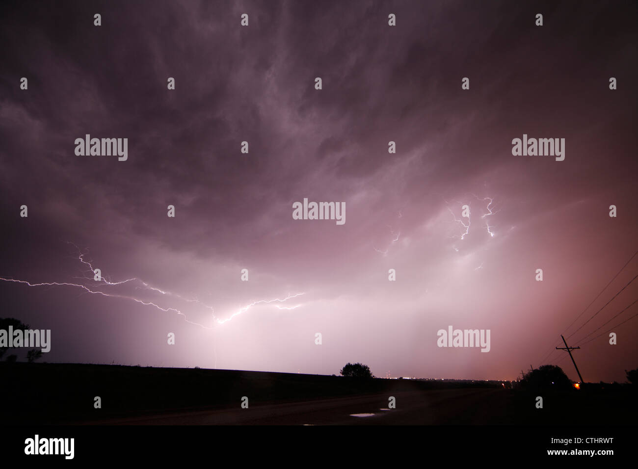 Lightning illuminates the underside of a squall line thunderstorm as it ...