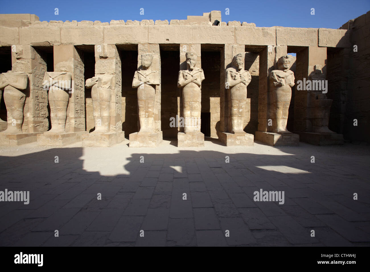 Osirian statues at temple of Pharaoh Ramses III, Karnak Temple Complex ...