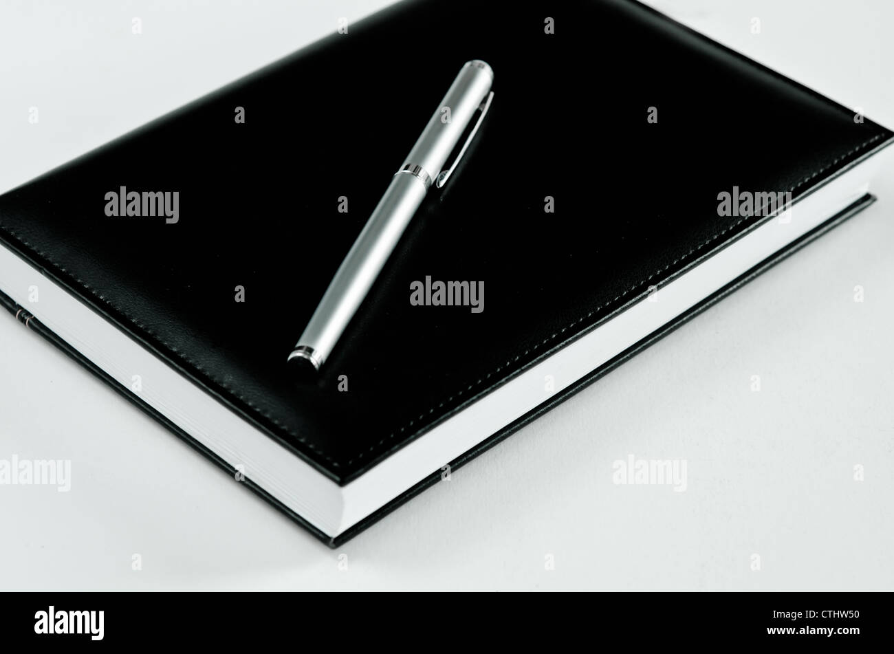 black note book and pen for records Stock Photo - Alamy