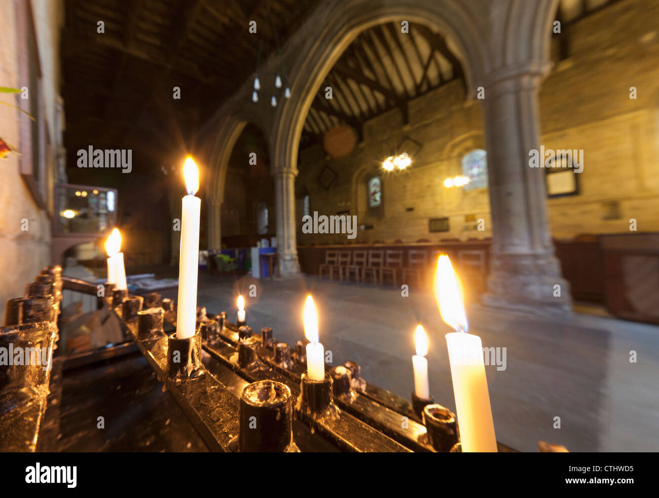 Candles Lit Inside A Church Building; Northumberland, England Stock ...