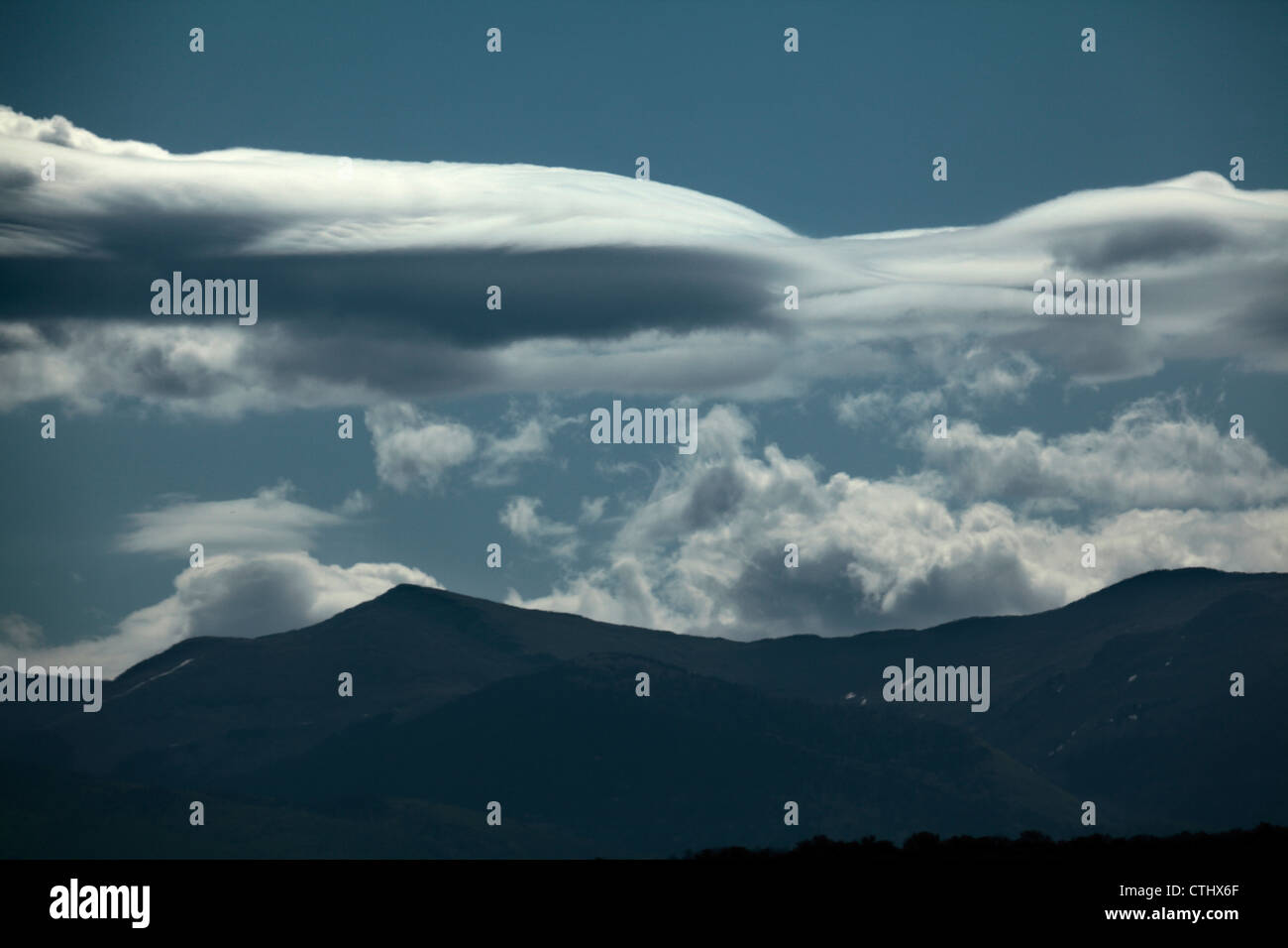Lenticular cloud formations over Colorado's Rocky Mountains, with weak ...