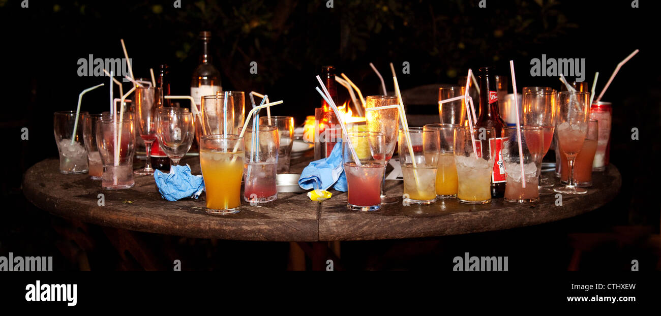 Party finished; A table full of half empty glasses after a party ended ...