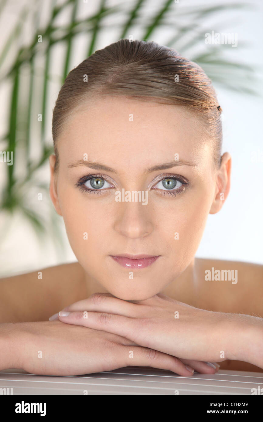 Woman resting head on table Stock Photo - Alamy
