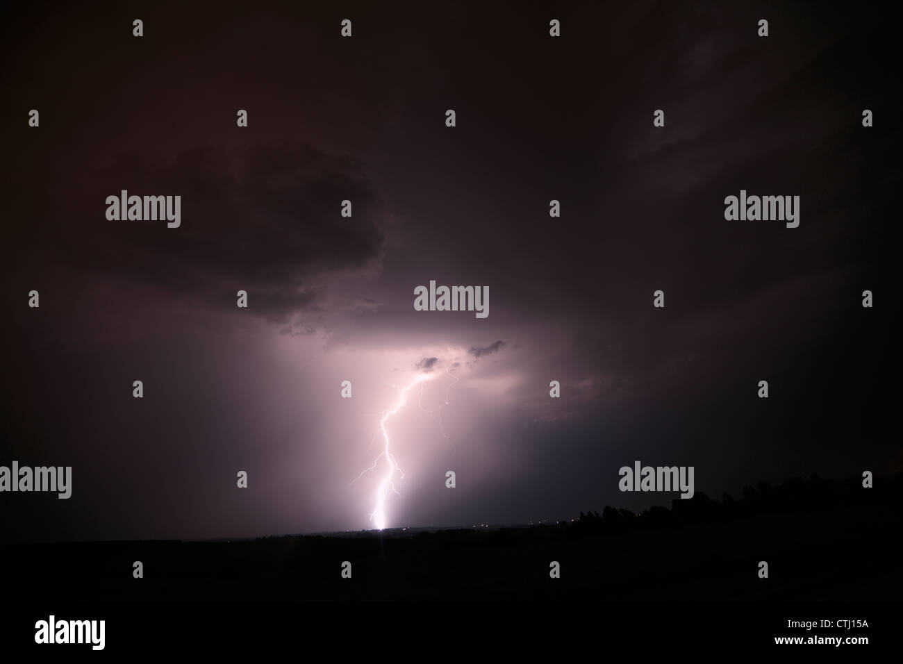 A single bolt lightning strike during a night storm Stock Photo - Alamy