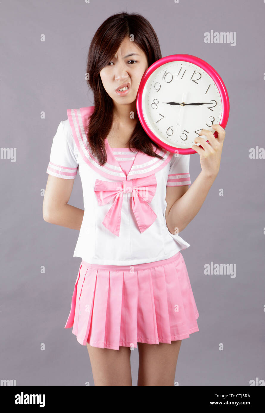 School girl plays clock Stock Photo - Alamy