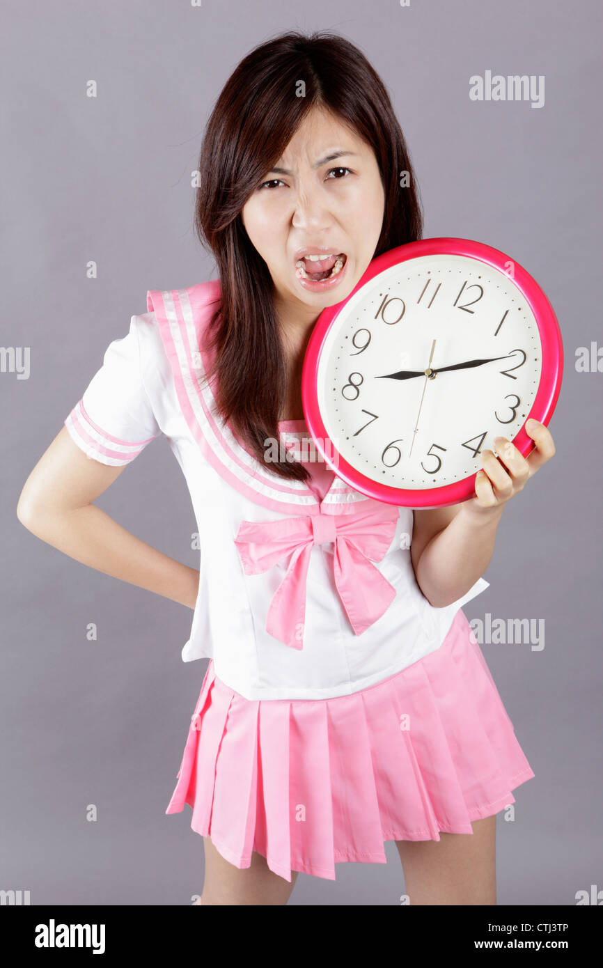 School girl plays clock Stock Photo - Alamy