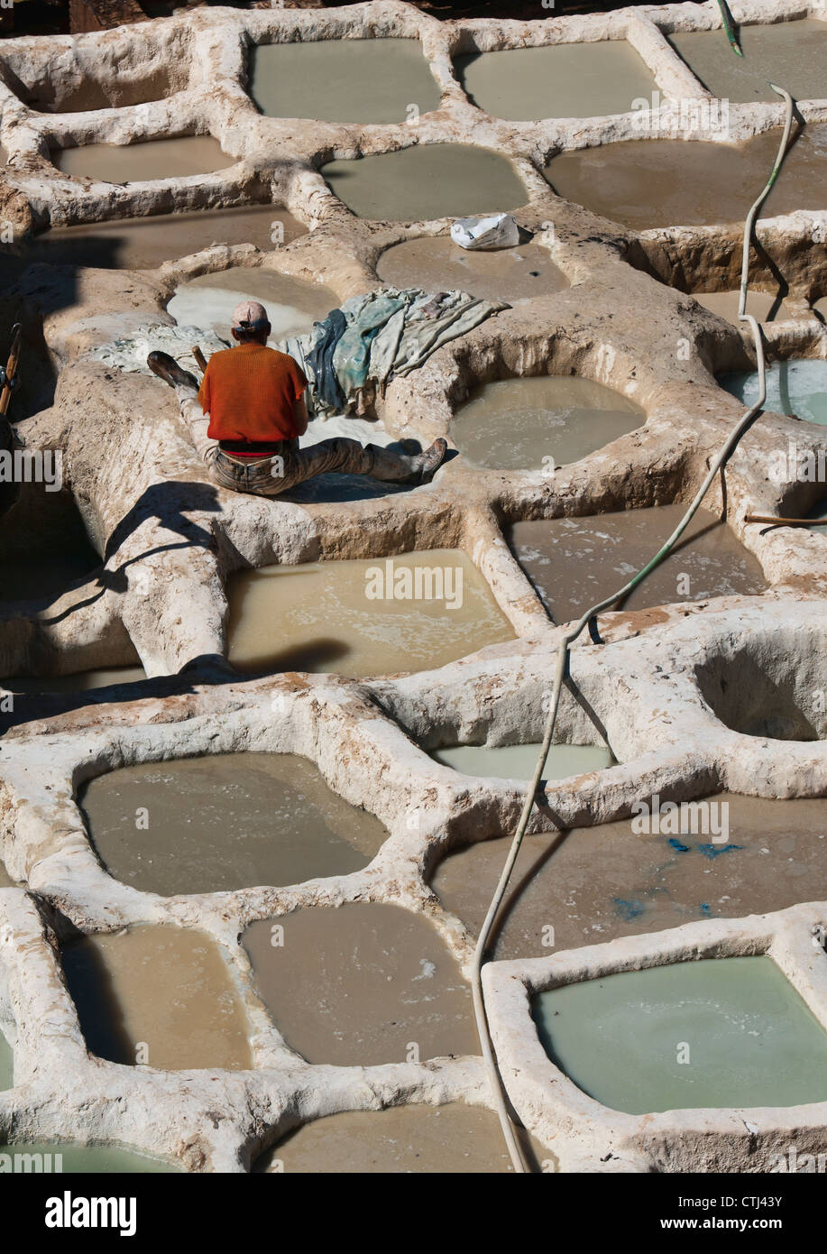 worker in the thousand year old leather tannery in the ancient medina ...