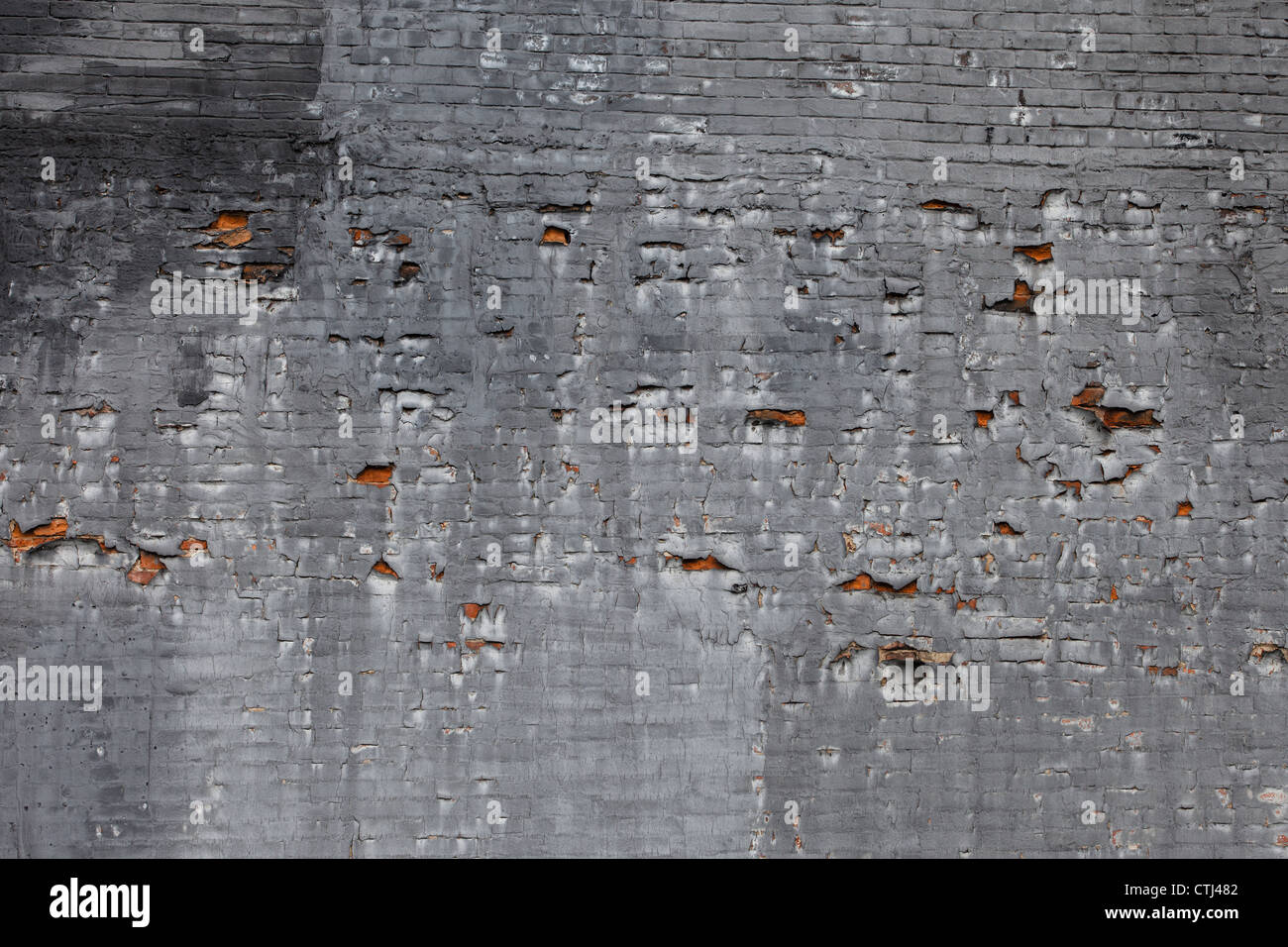 Torn and peeling paint on a brick wall background Stock Photo - Alamy