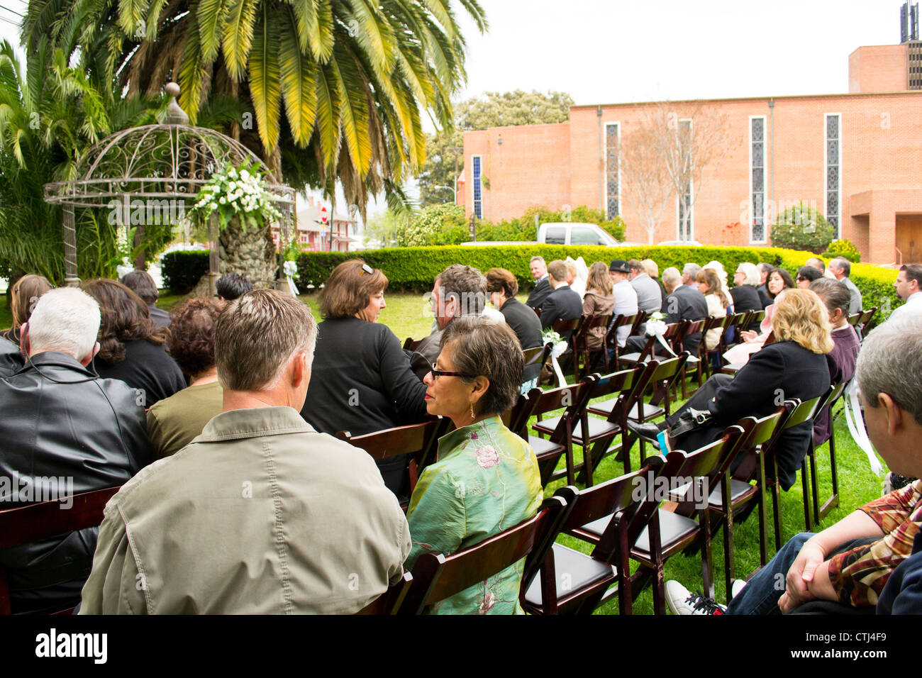 The audience waiting for the wedding to start Stock Photo - Alamy