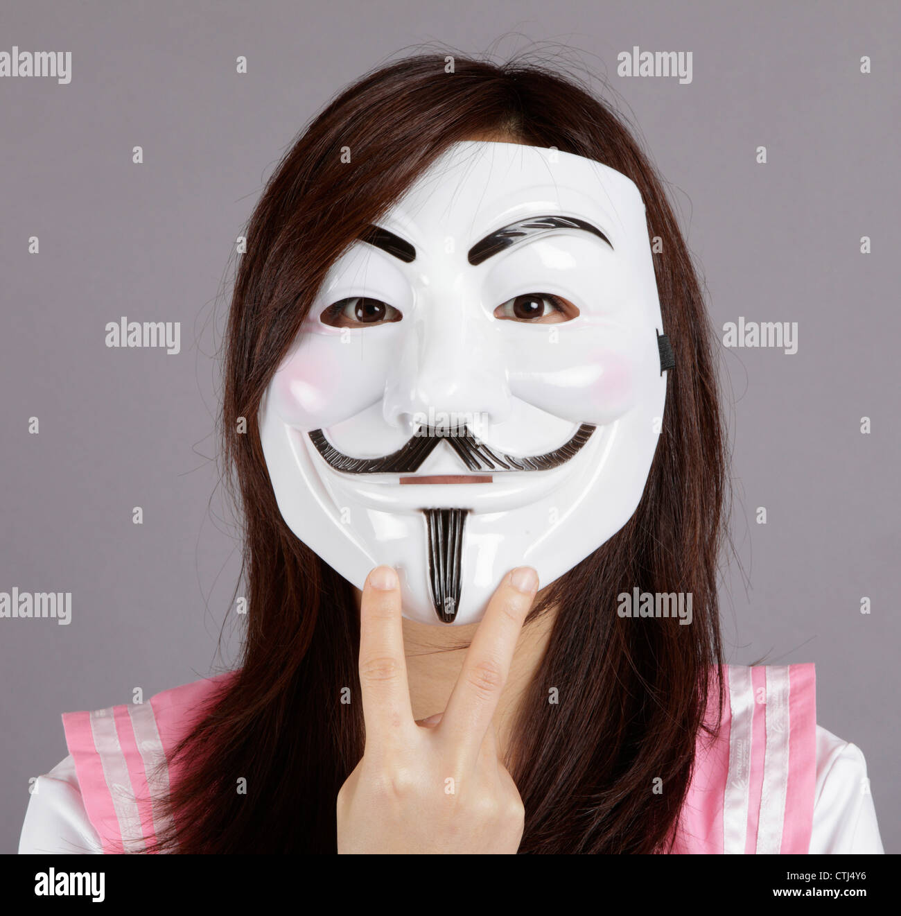 School girl wears V mask Stock Photo - Alamy