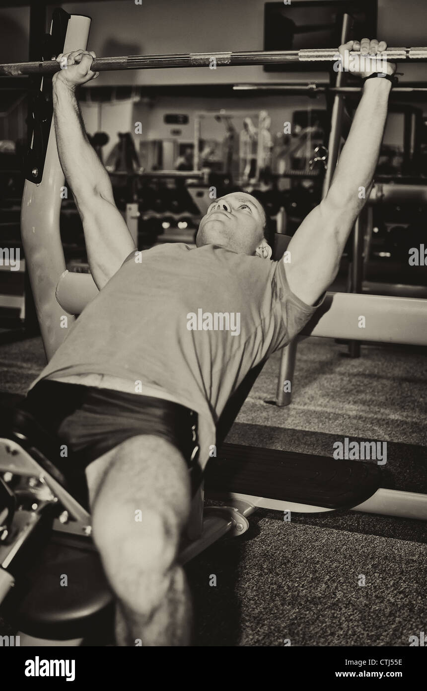 Man doing athlete exercise in fitness club Stock Photo - Alamy