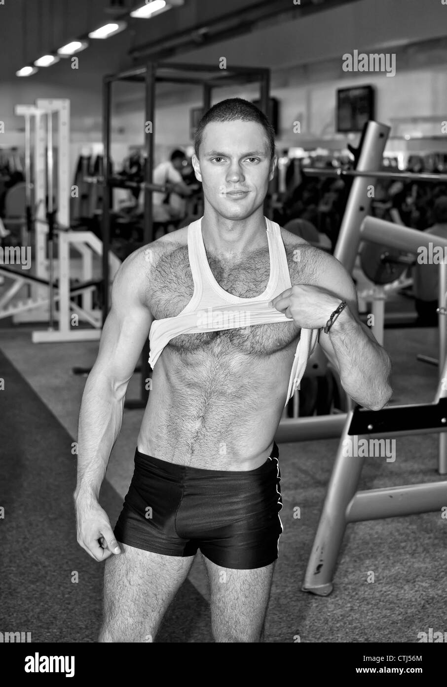 Handsome bodybuilder showing his body in a gym Stock Photo - Alamy