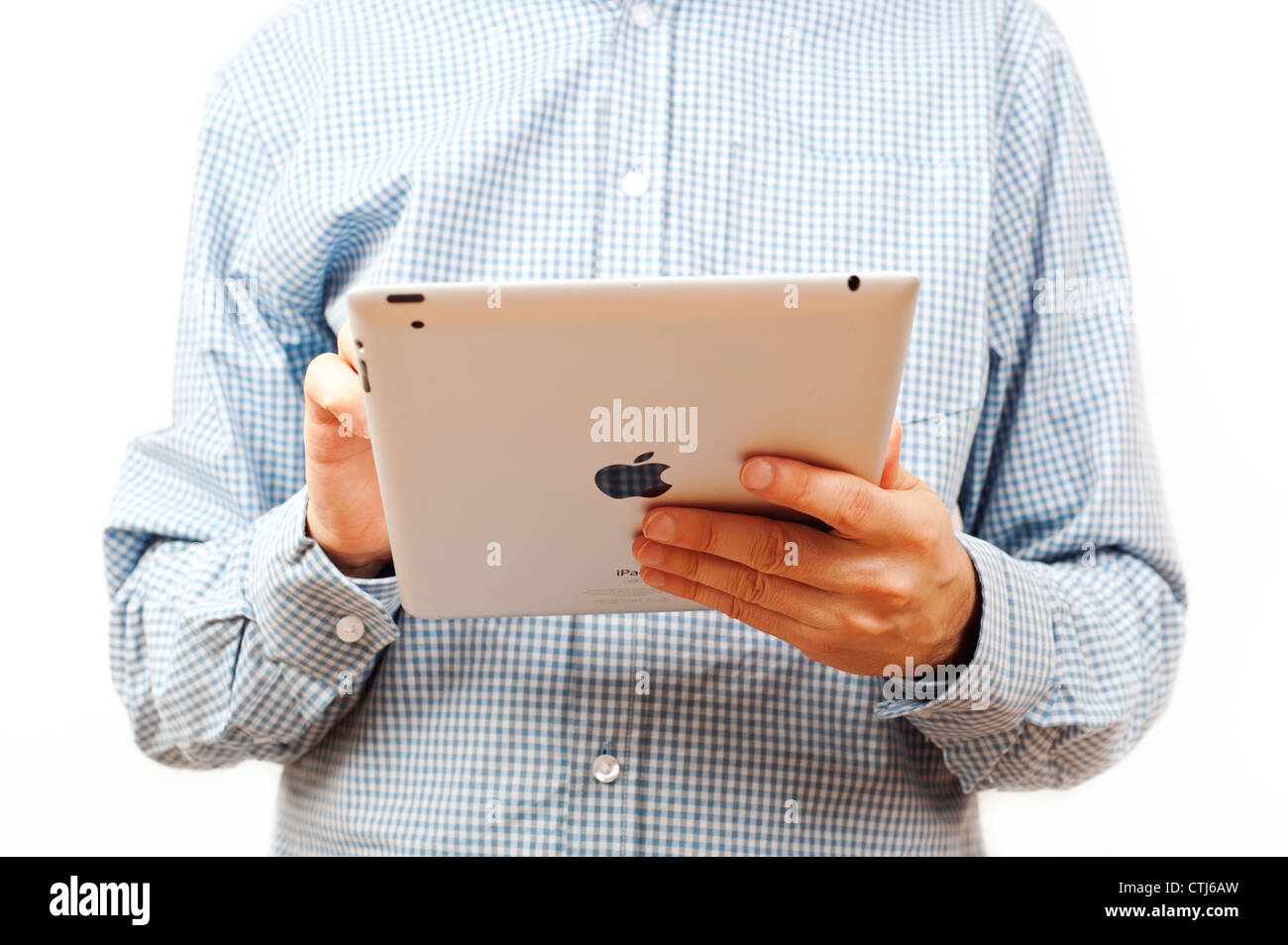 man using an iPad tablet Stock Photo - Alamy