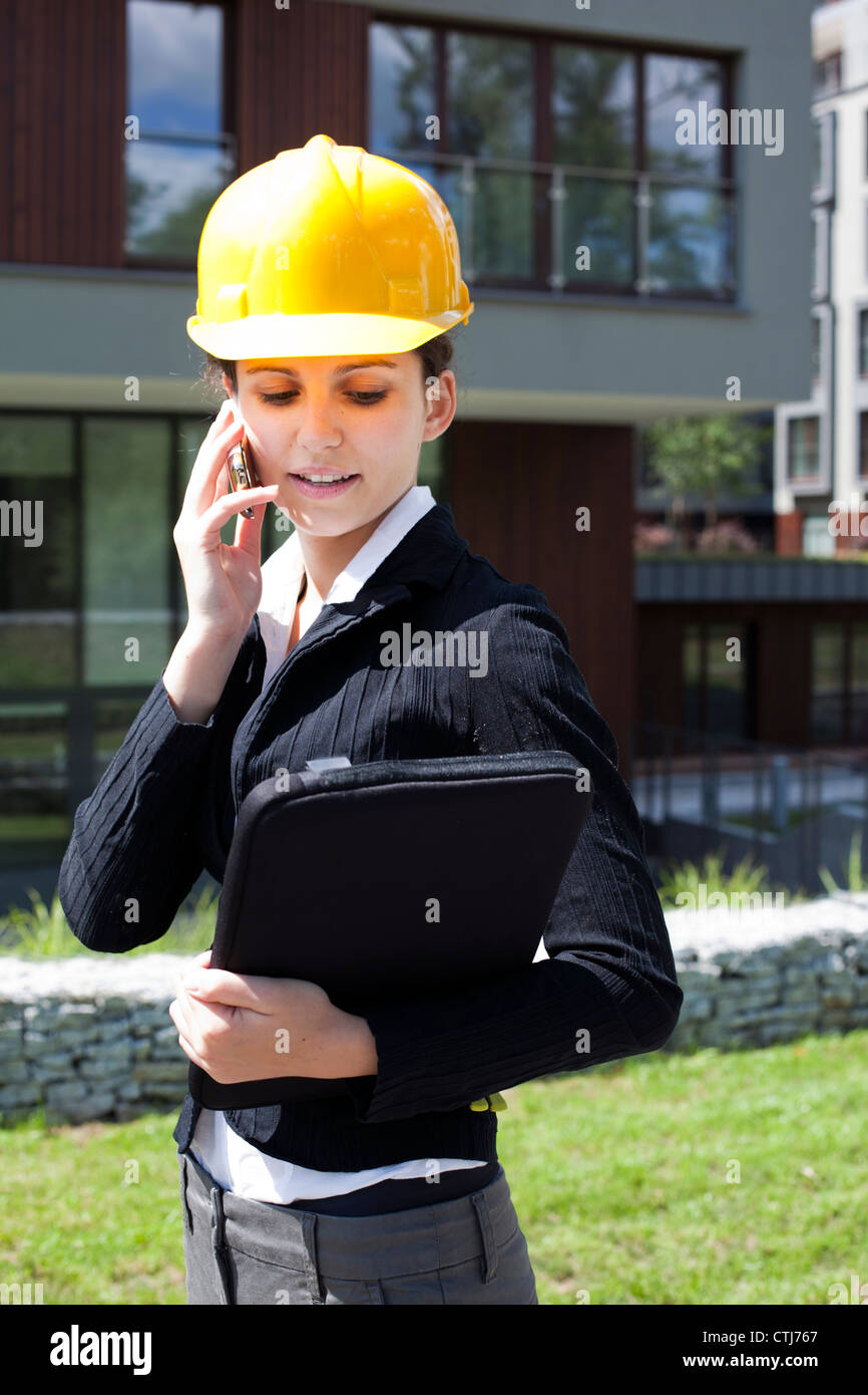 Female construction engineer calling Stock Photo - Alamy
