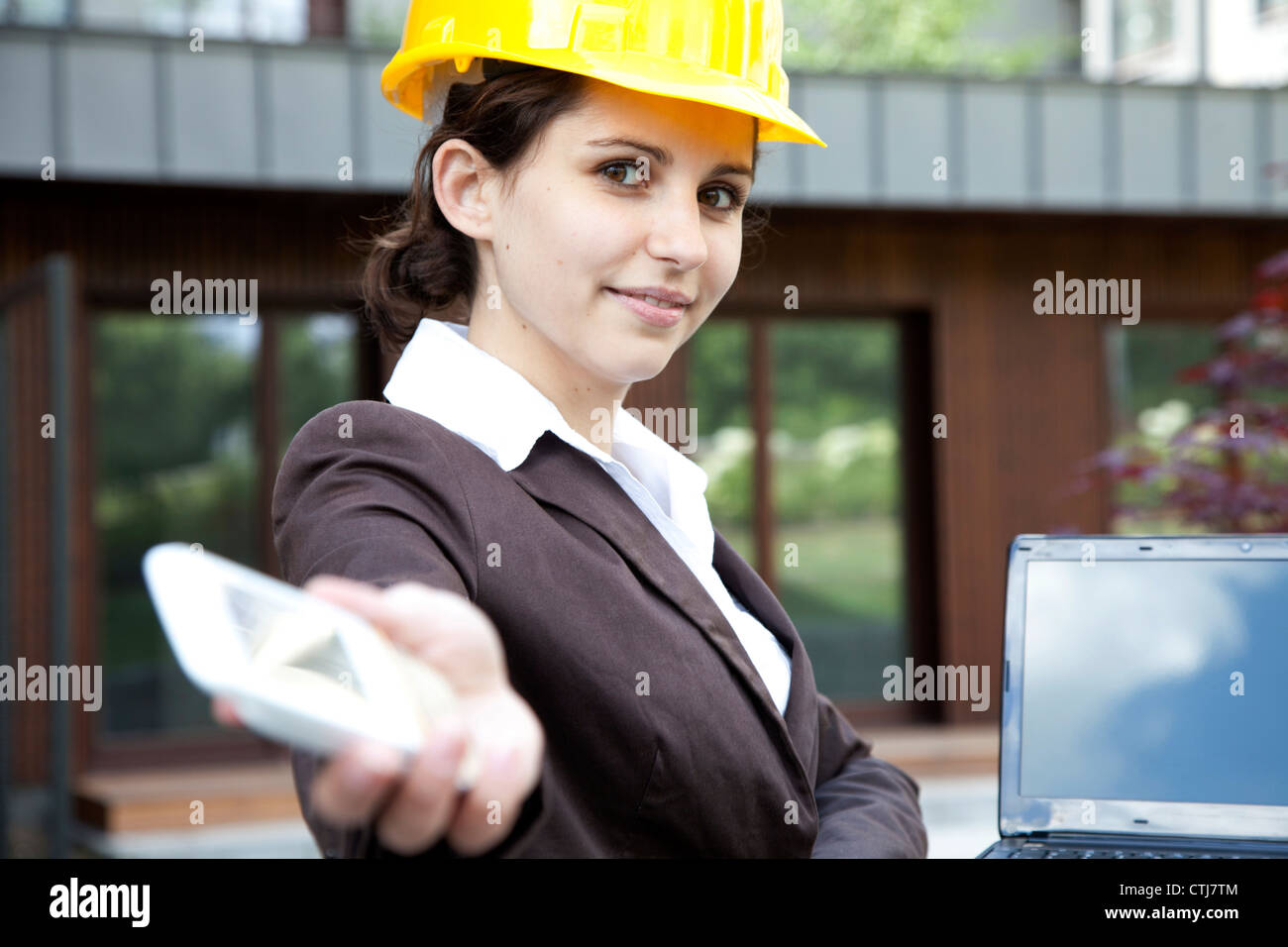 Female construction engineer calling Stock Photo - Alamy