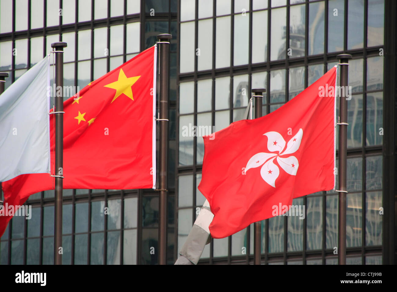 Flags of China and Hong Kong blowing on poles Stock Photo - Alamy
