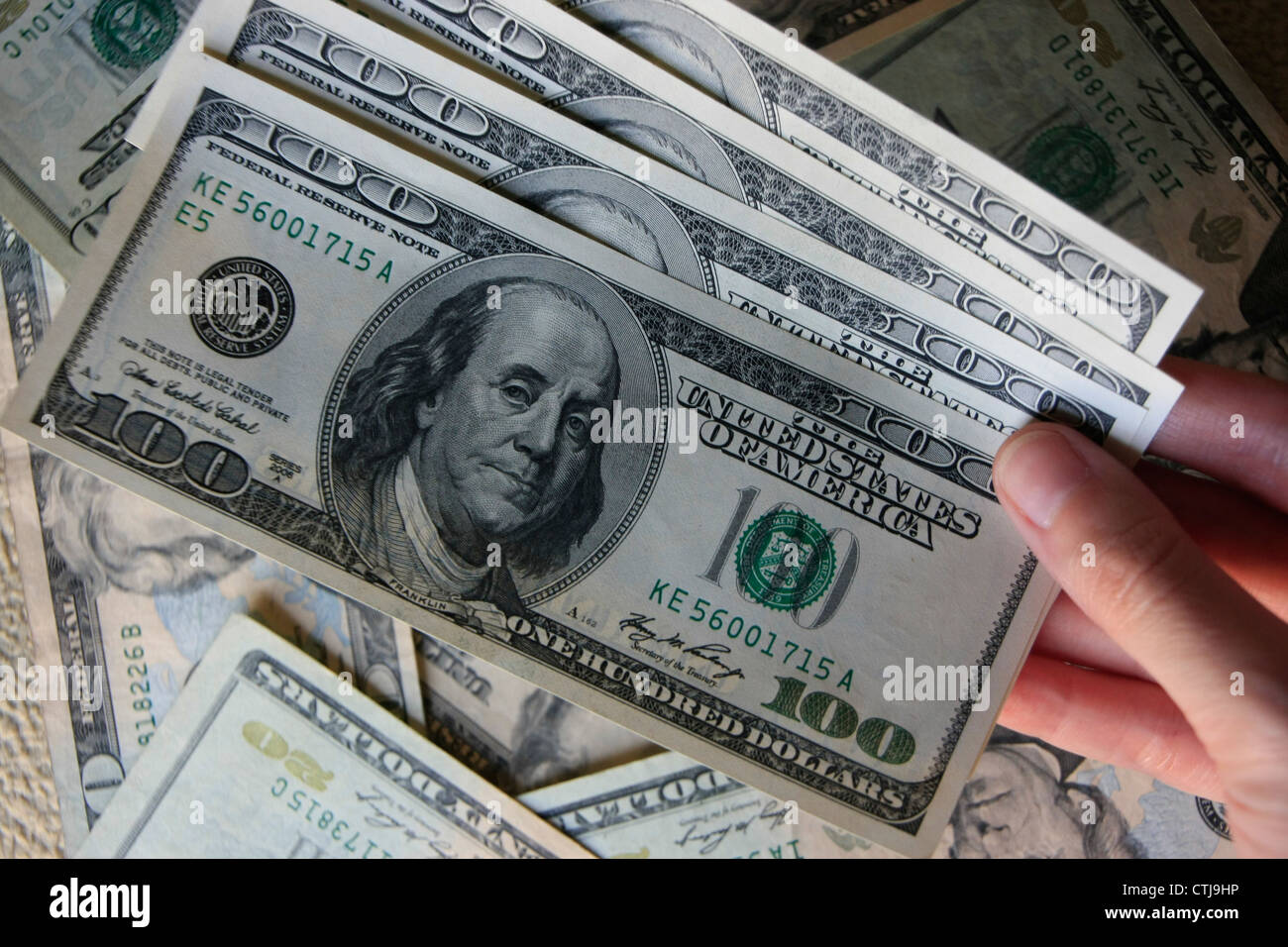 Hand with dollars Stock Photo - Alamy