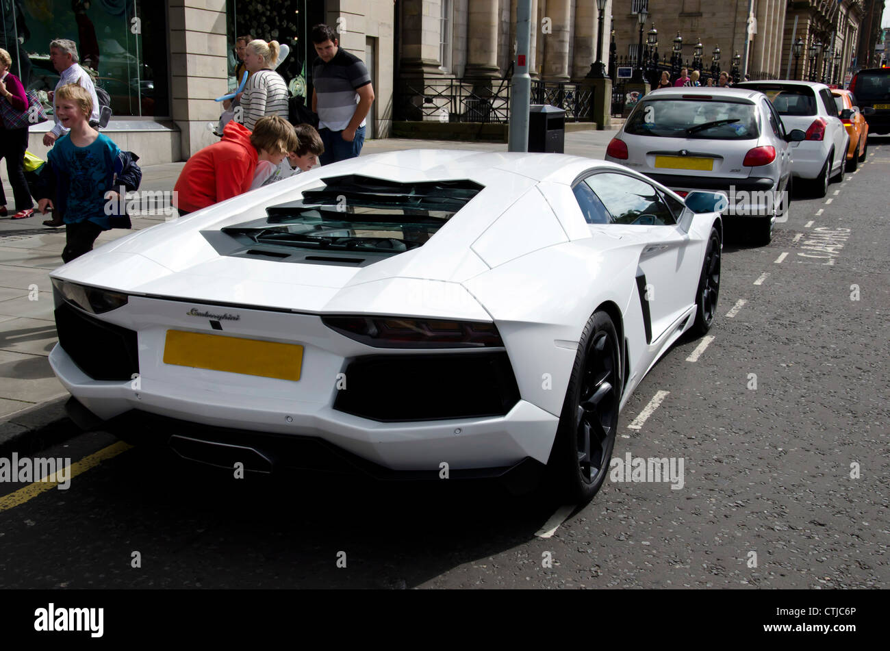 Children admiring a Lamborghini car parked in the Centre of Edinburgh ...