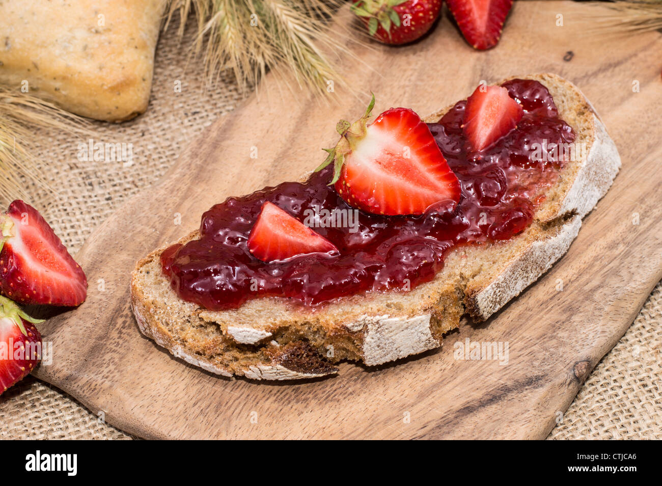 Rustic Bread with fresh Strawberry Jam and fruits Stock Photo - Alamy