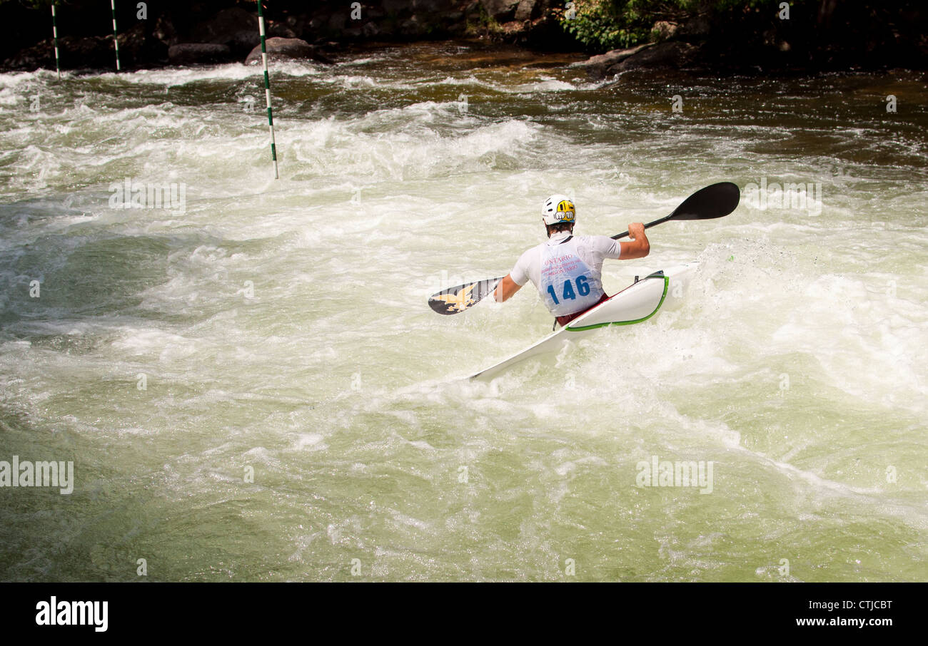 Kayak in a whitewater slalom race Stock Photo - Alamy