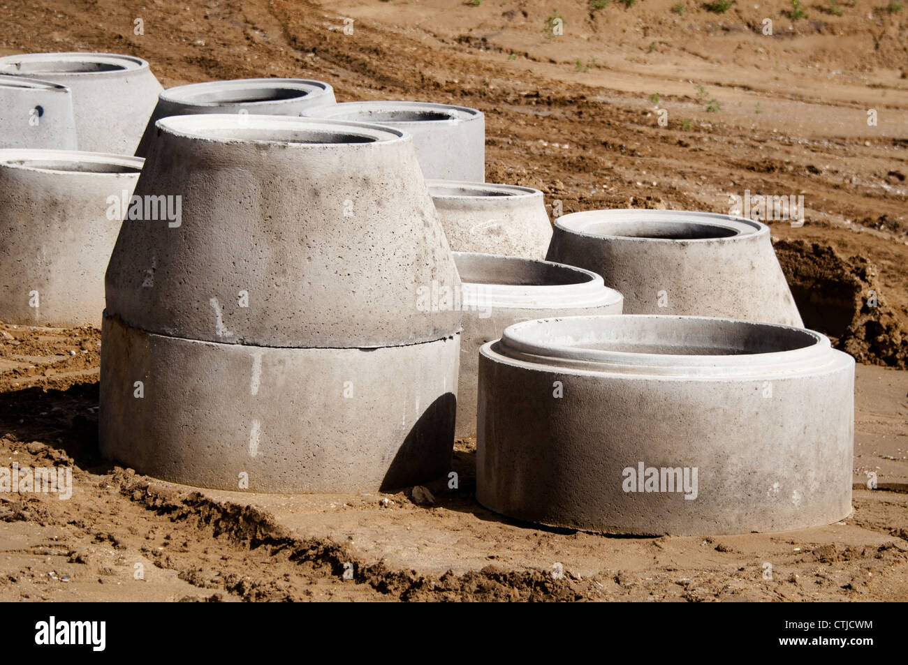 concrete drainage pipes on a construction site for a highway extension ...