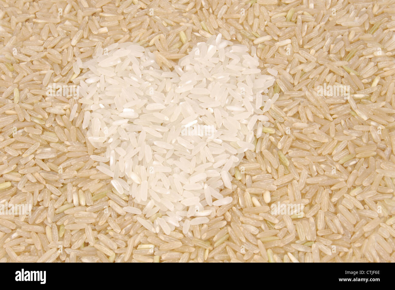 Heart shape made from brown and white rice grains Stock Photo - Alamy