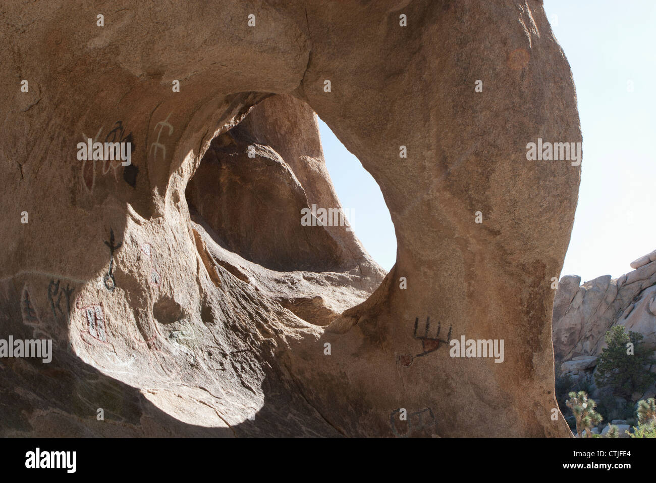 Large Hole Eroded Out Of Rounded Rock Formation With Petroglyphs And ...