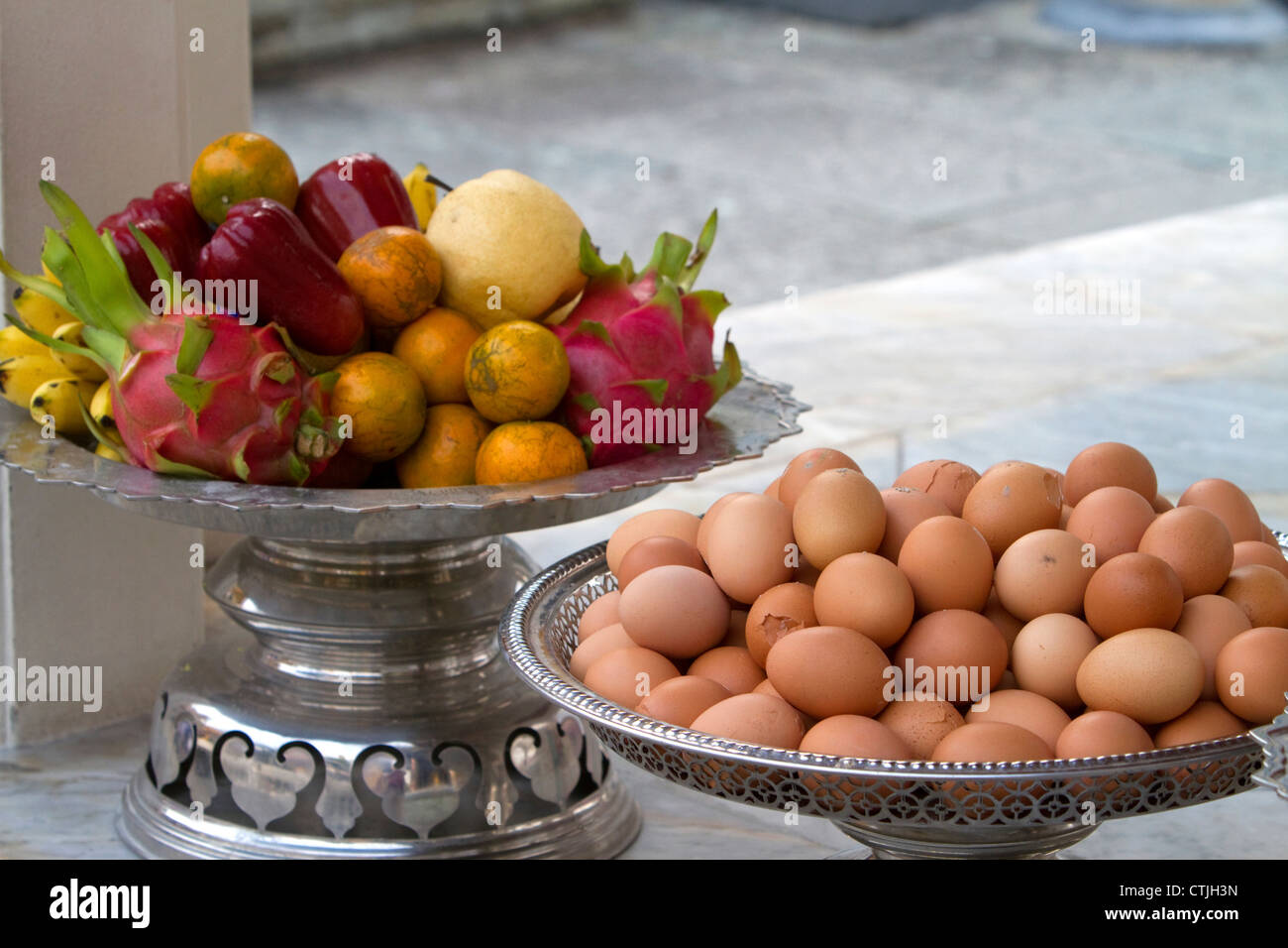 Fruit and egg offerings at the Temple of the Emerald Buddha located ...