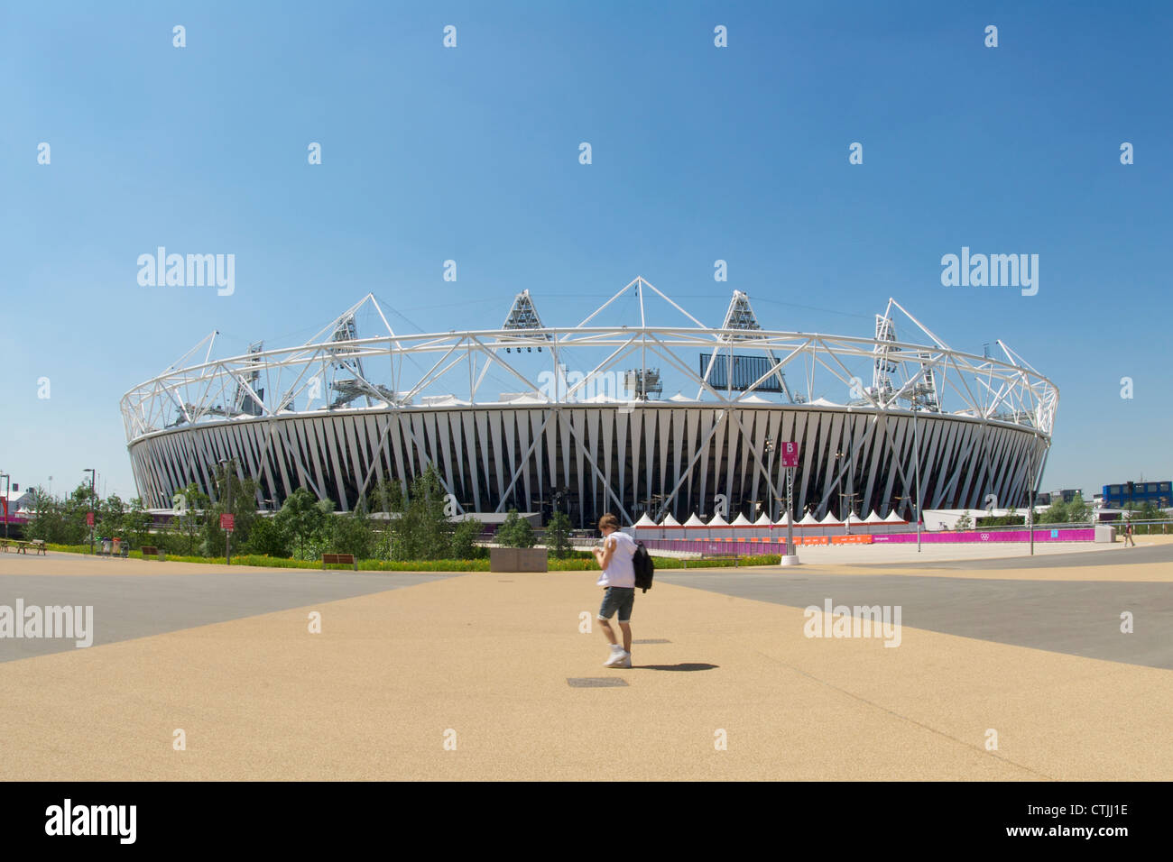 Olympic stadium and lone spectator Stock Photo - Alamy