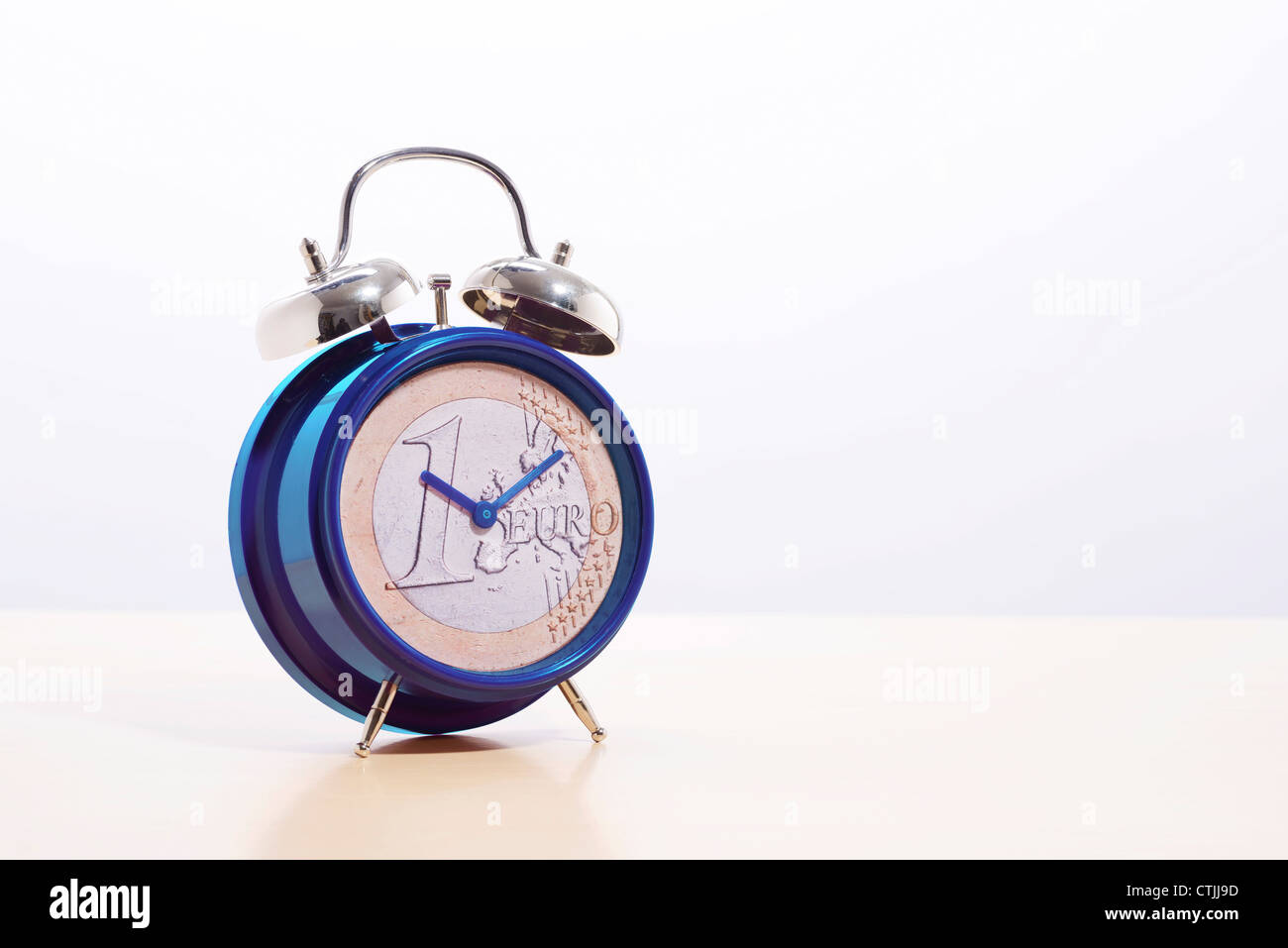 EU Europe euro coin on an alarm clock Stock Photo - Alamy