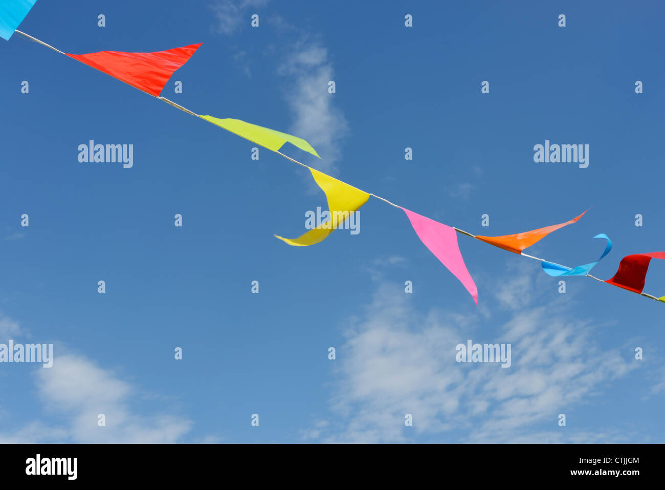 Colourful bunting and blue sky Stock Photo - Alamy