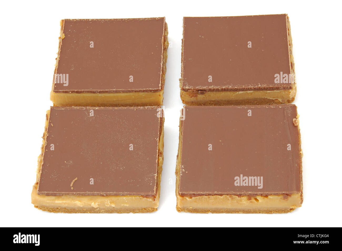 Four chocolate caramel slices isolated on a white background Stock ...