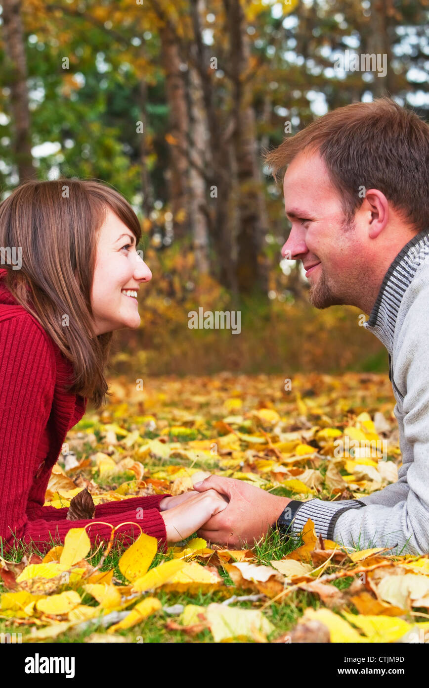 Young Married Couple Spending Quality Time Together In A Park In Autumn ...
