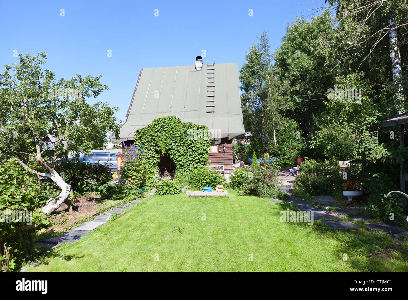 Country wooden Russian house with green grass backyard. Russia Stock ...