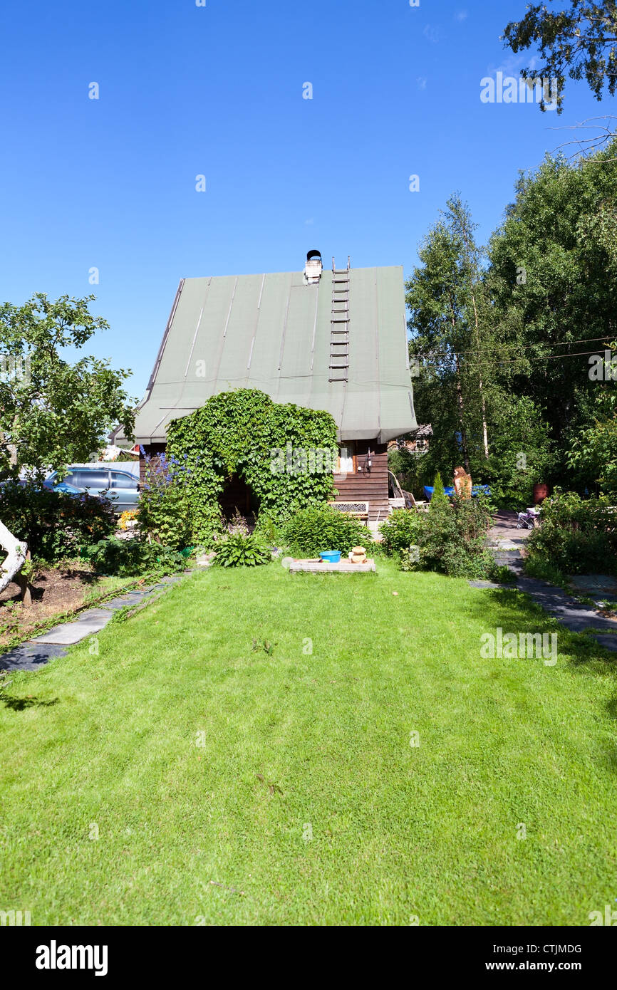 Country wooden Russian house with green grass backyard. Russia Stock ...