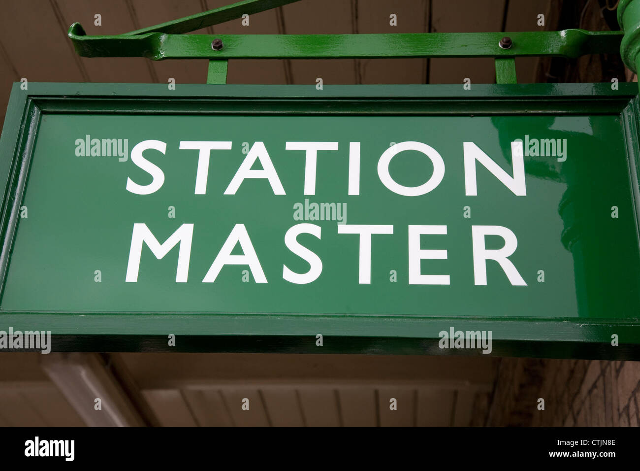 Green Station Master Sign on Railroad Platform Stock Photo - Alamy