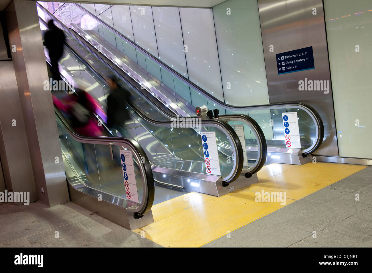 Kings cross station escalators hi-res stock photography and images - Alamy