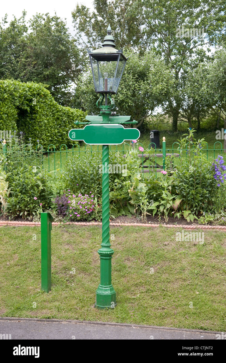 Green Lamppost with Empty Sign Stock Photo - Alamy
