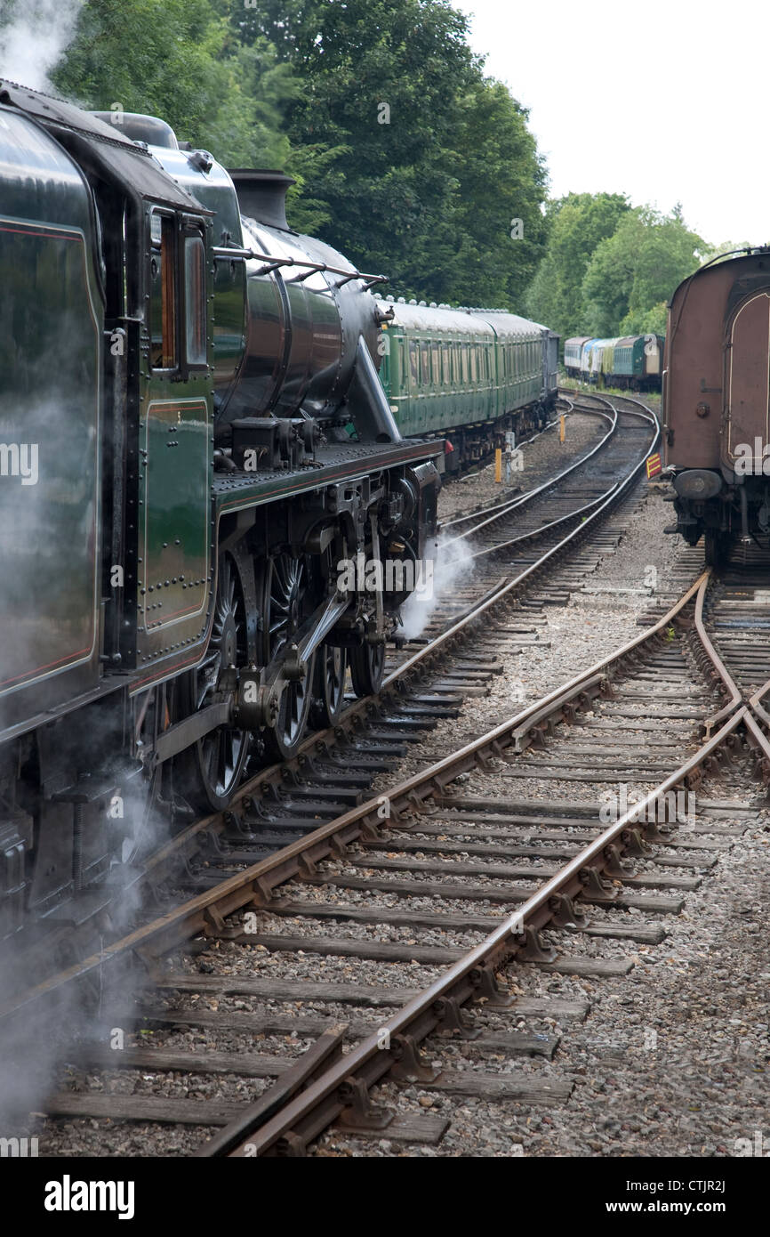 Stream Train on Railway Tracks Stock Photo - Alamy