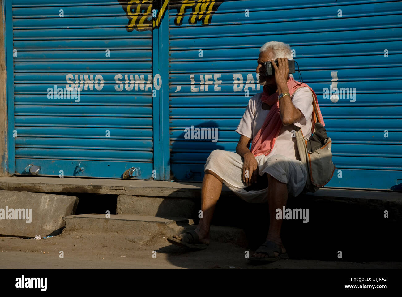 Indian old man listening music hi-res stock photography and images - Alamy