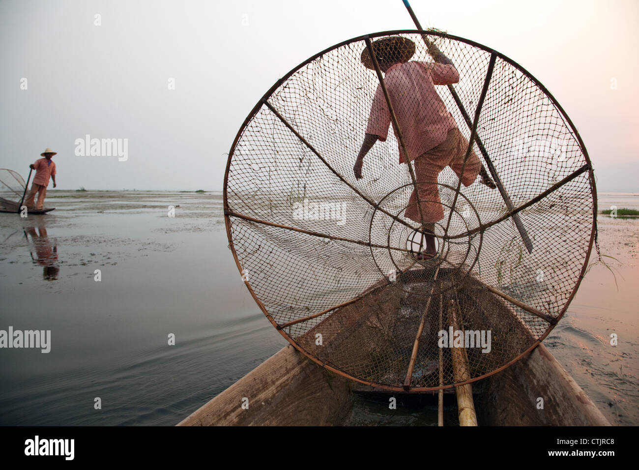 Burmese fishermen at work - traditional fishing on Inle Lake in Myanmar ...