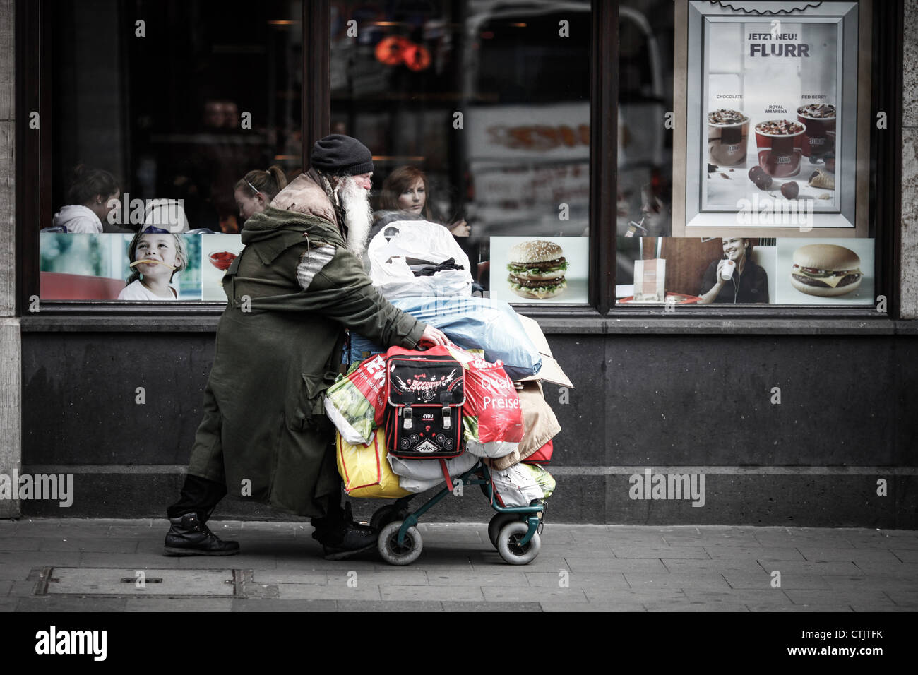 homeless person with trolley Stock Photo - Alamy