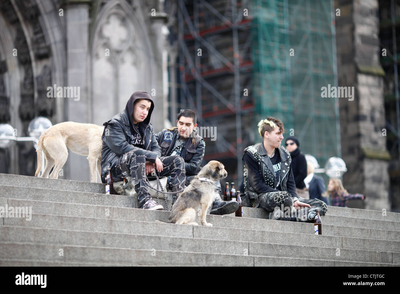 alternative people sitting on stairs Stock Photo - Alamy