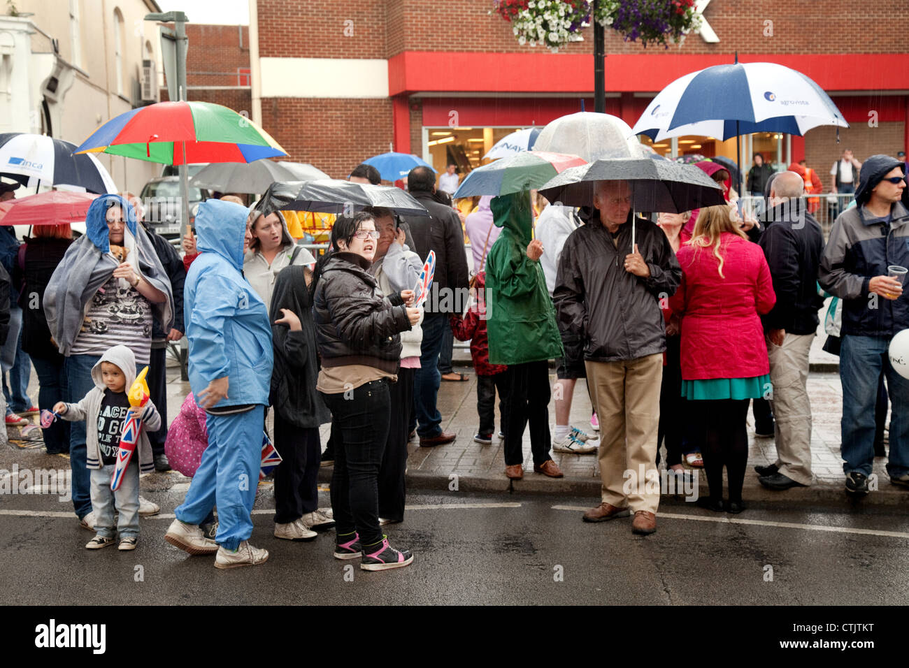 British people standing in the rain in wet weather, UK Stock Photo - Alamy