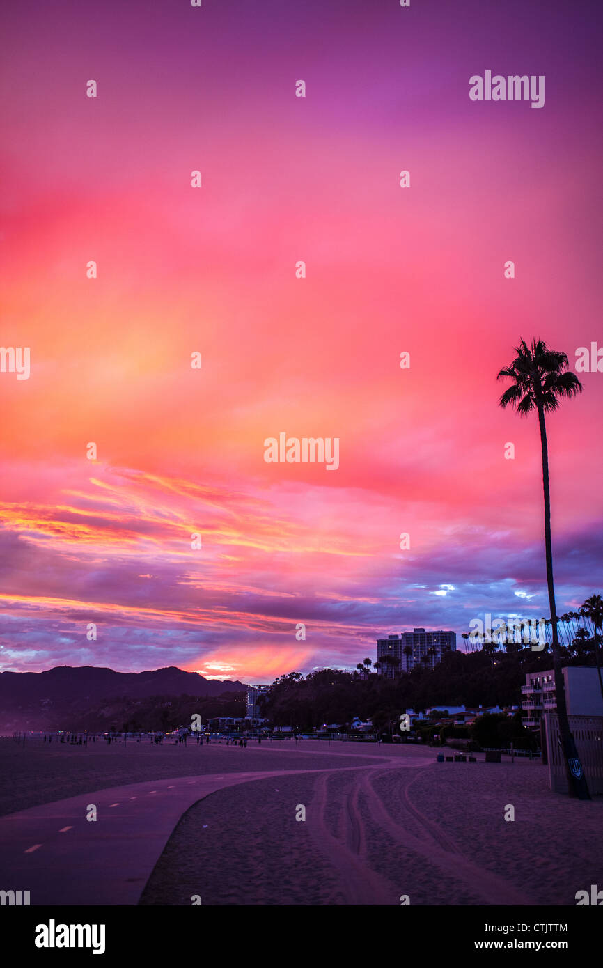 A spectacular red sunset at the beach in Santa Monica California ...