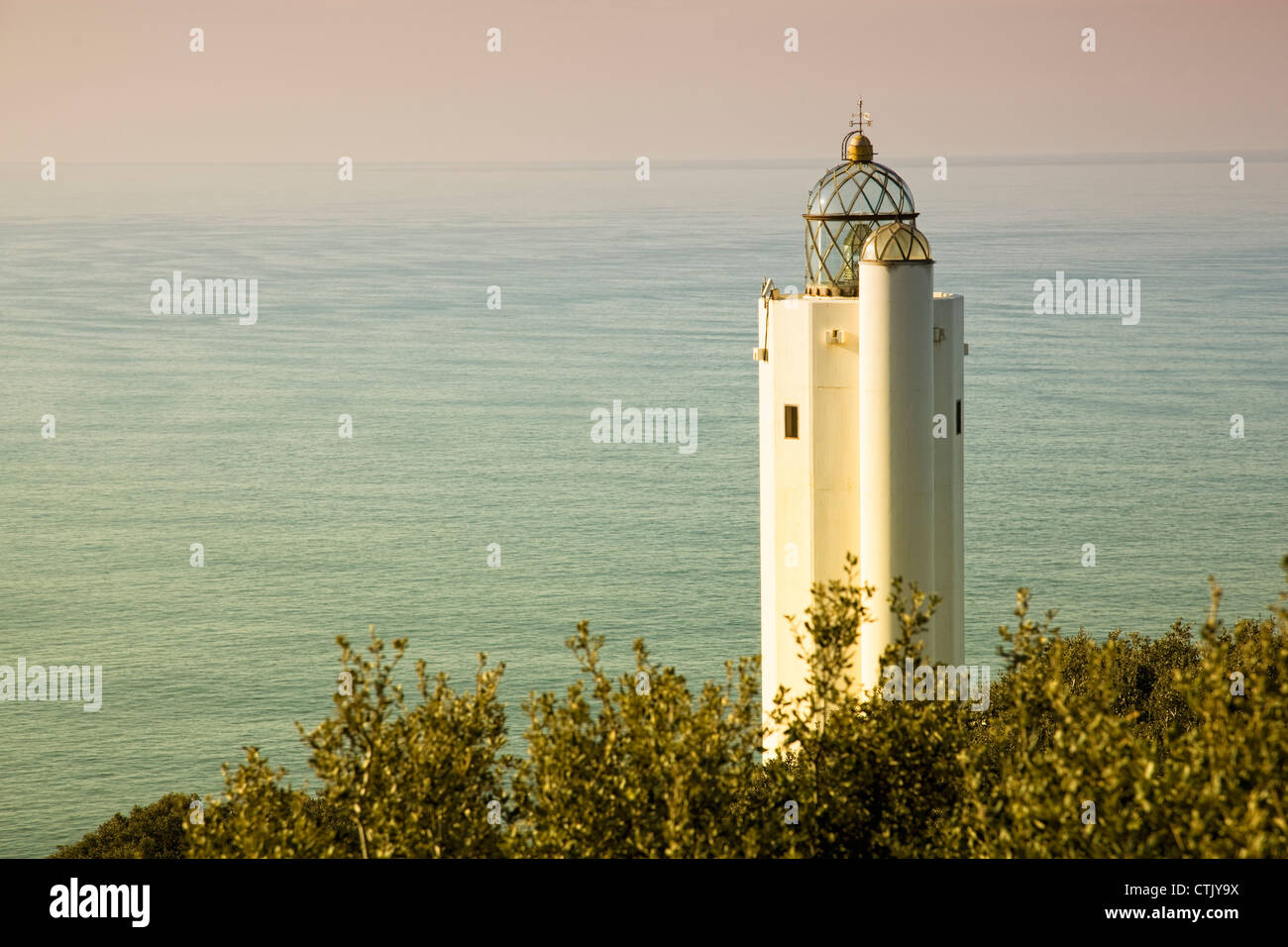 View of a white lighthouse during daylight against the sea Stock Photo ...