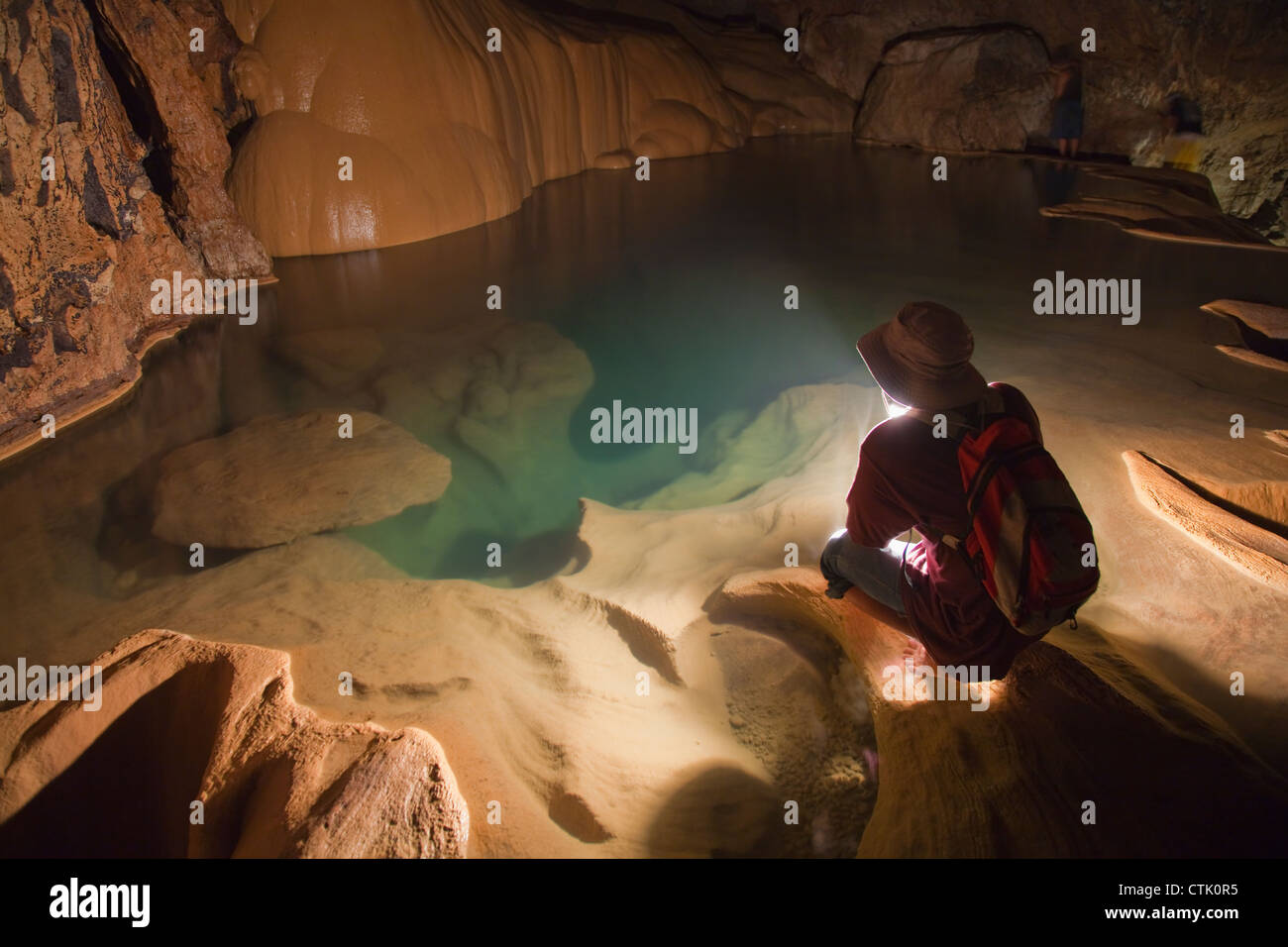 A Filipino Tour Guide Holds A Lantern Inside Sumaging Cave Or Big Cave ...